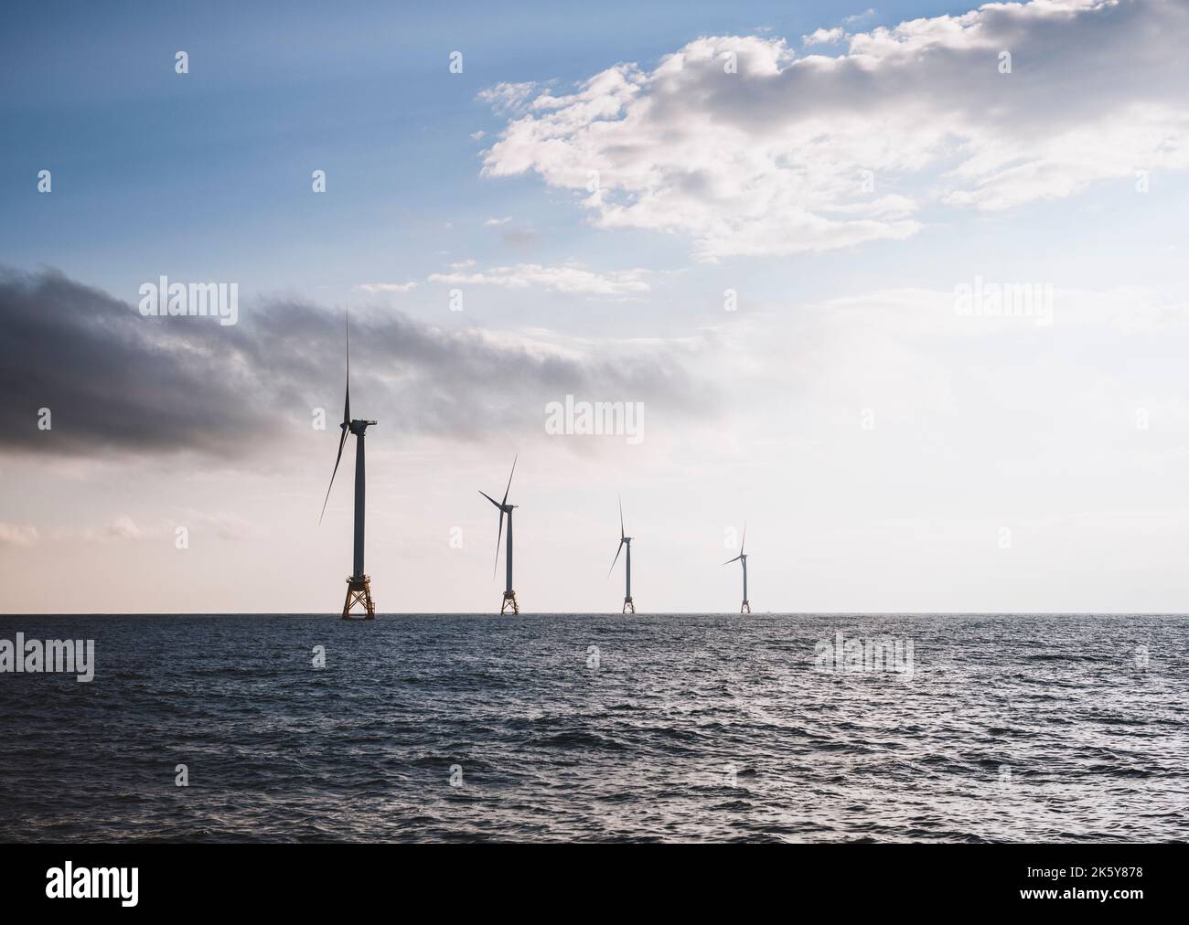 Four off shore wind turbines for alternative renewable energyu Stock ...