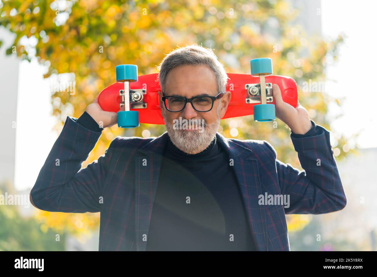 Unexpected hobby of elder caucasian elegant man with gray facial hair ...