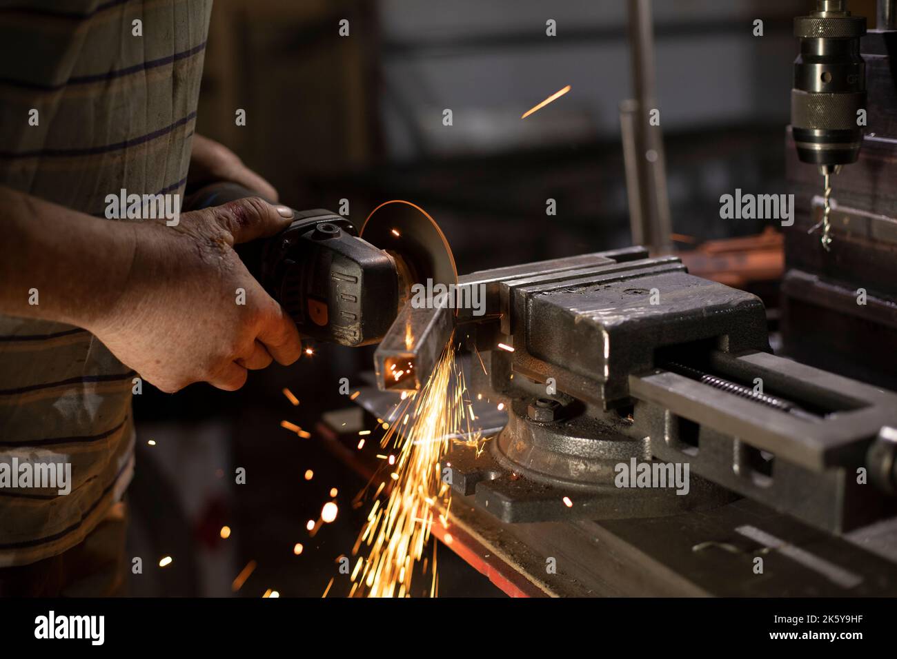 Metal treatment. Grinding of steel. Sparks from disk Stock Photo - Alamy