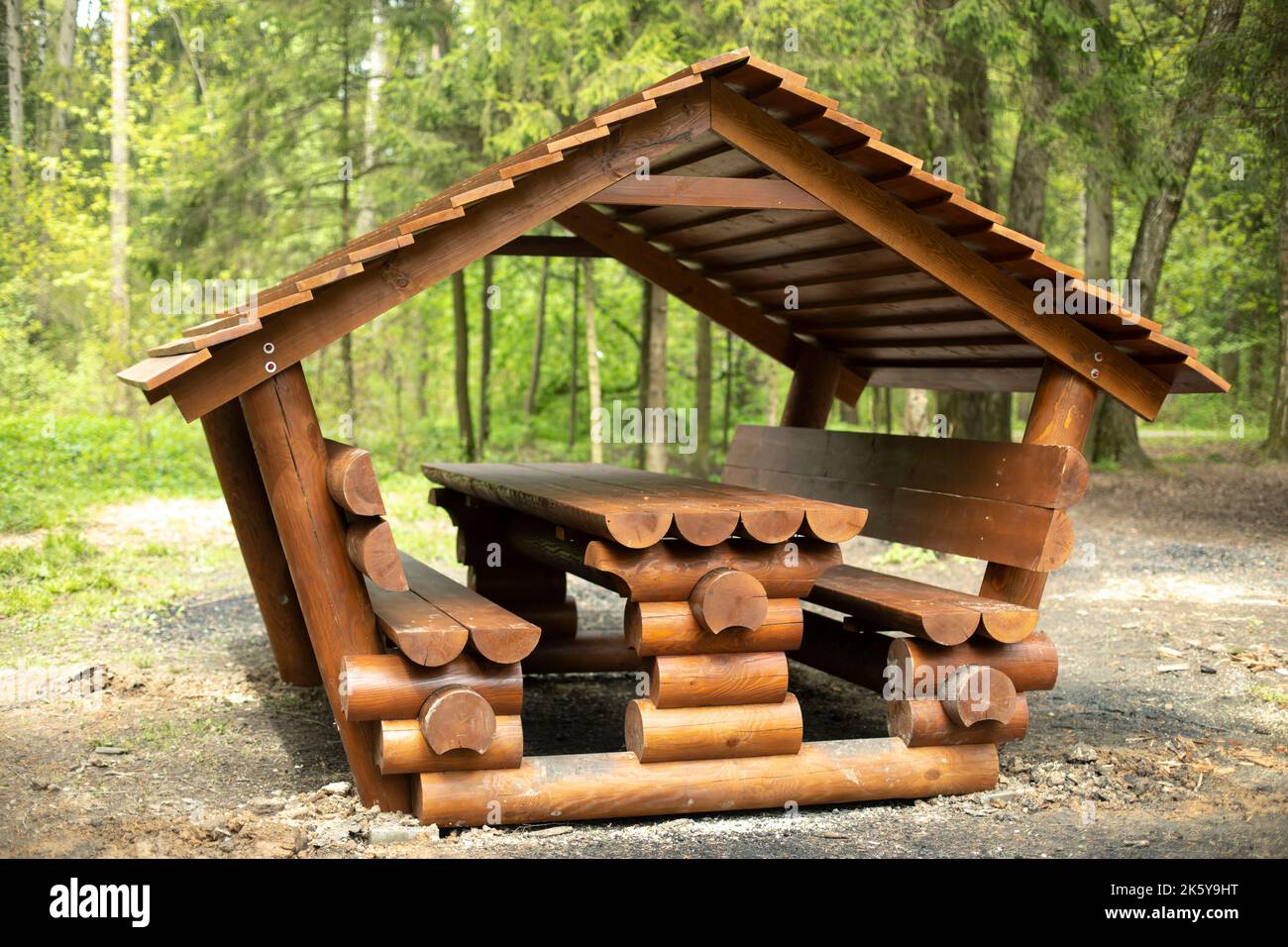 Wooden picnic house in park. Log building Stock Photo - Alamy