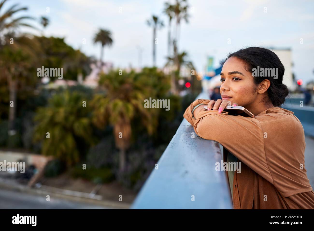 Woman resting head on arms hi-res stock photography and images - Alamy