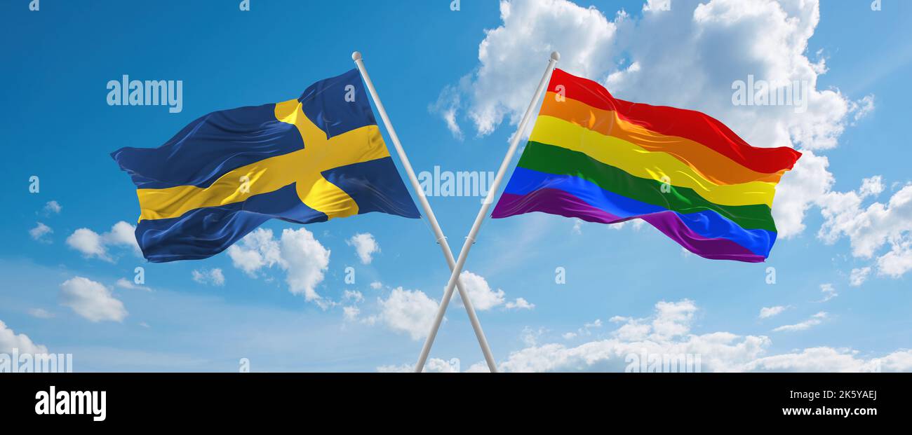 two crossed flags LGBT Pride and Sweden waving in wind at cloudy sky ...