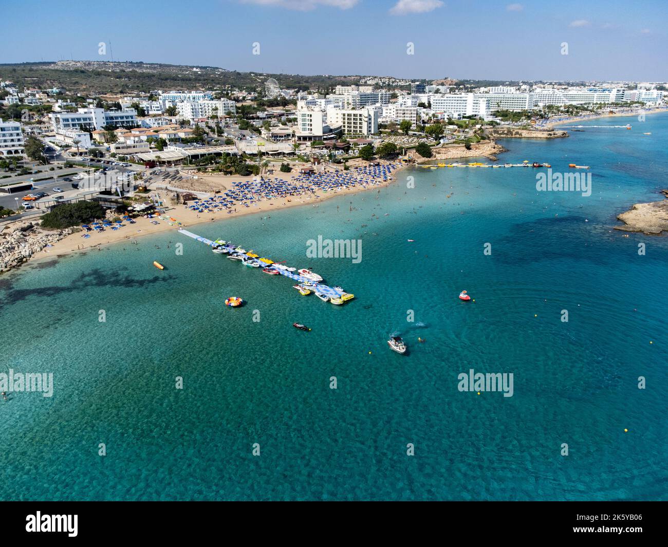 Aerial panoramic view on villas and holidays resorts and blue crystal ...