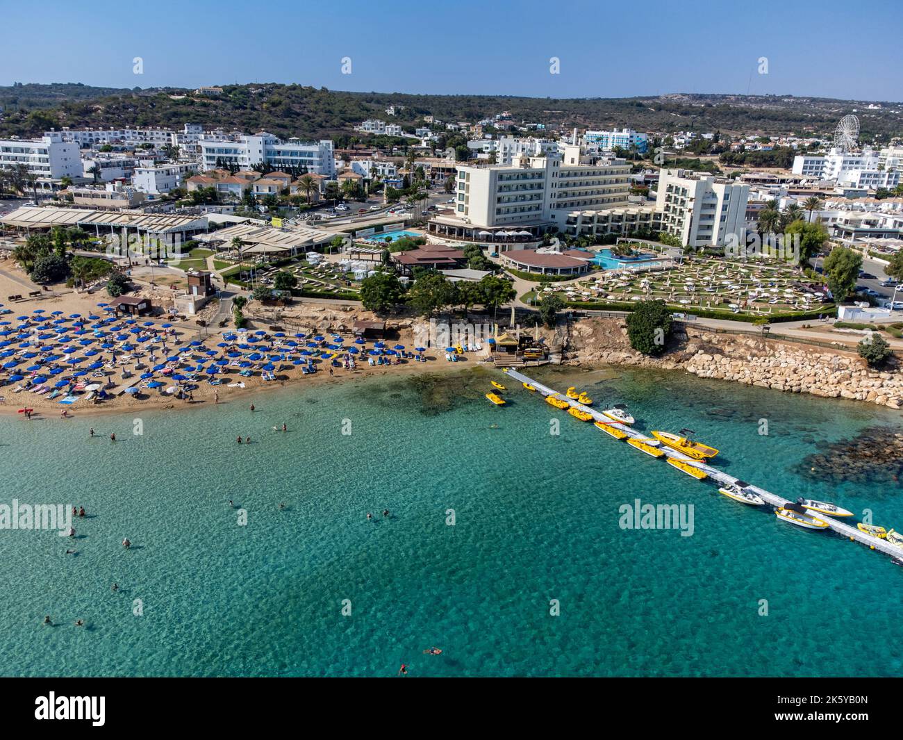Aerial panoramic view on villas and holidays resorts and blue crystal ...