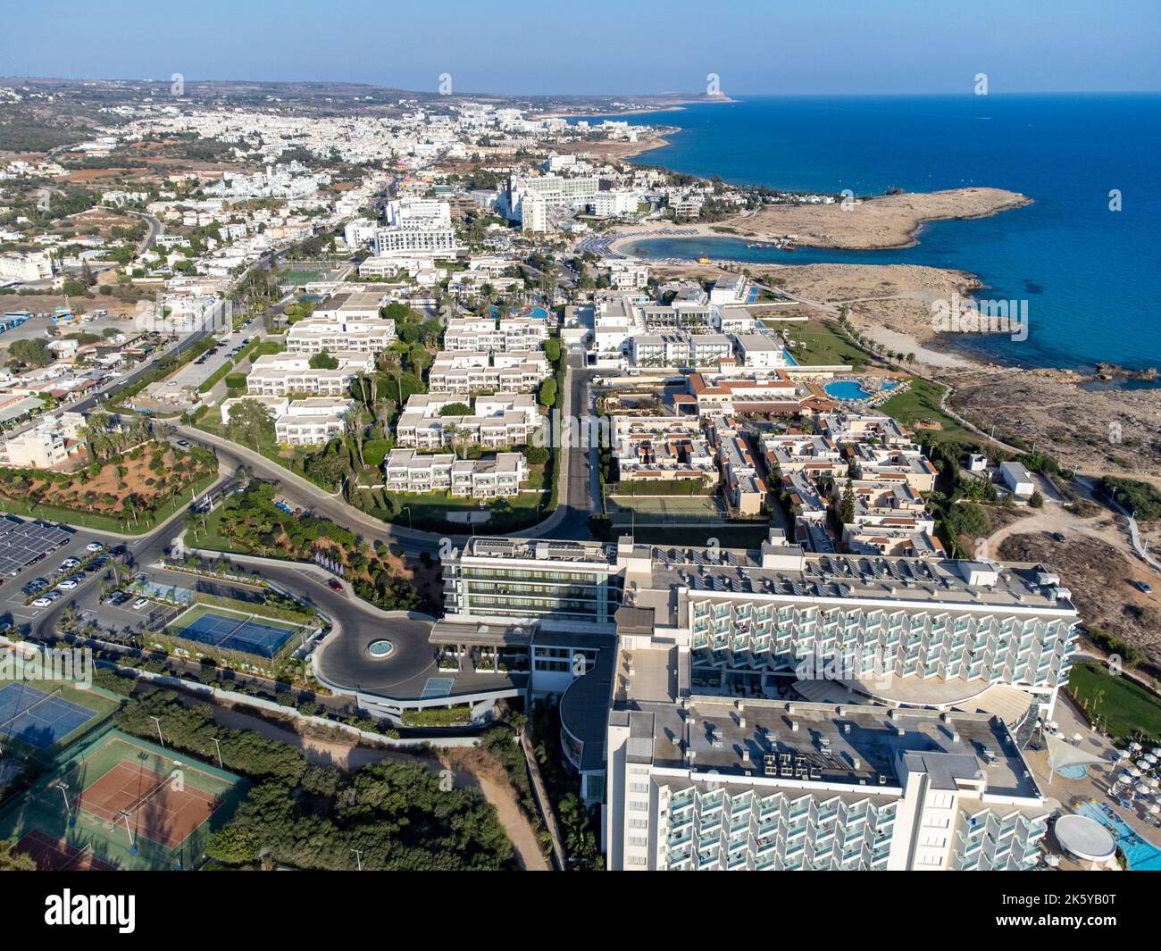 Aerial panoramic view on holidays villas and resorts and blue crystal ...