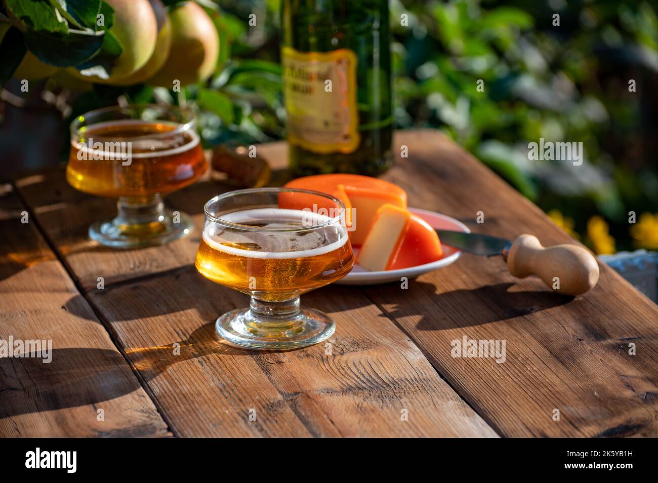 Food and drink pairing, apple cider in glasses produced on organic farm ...