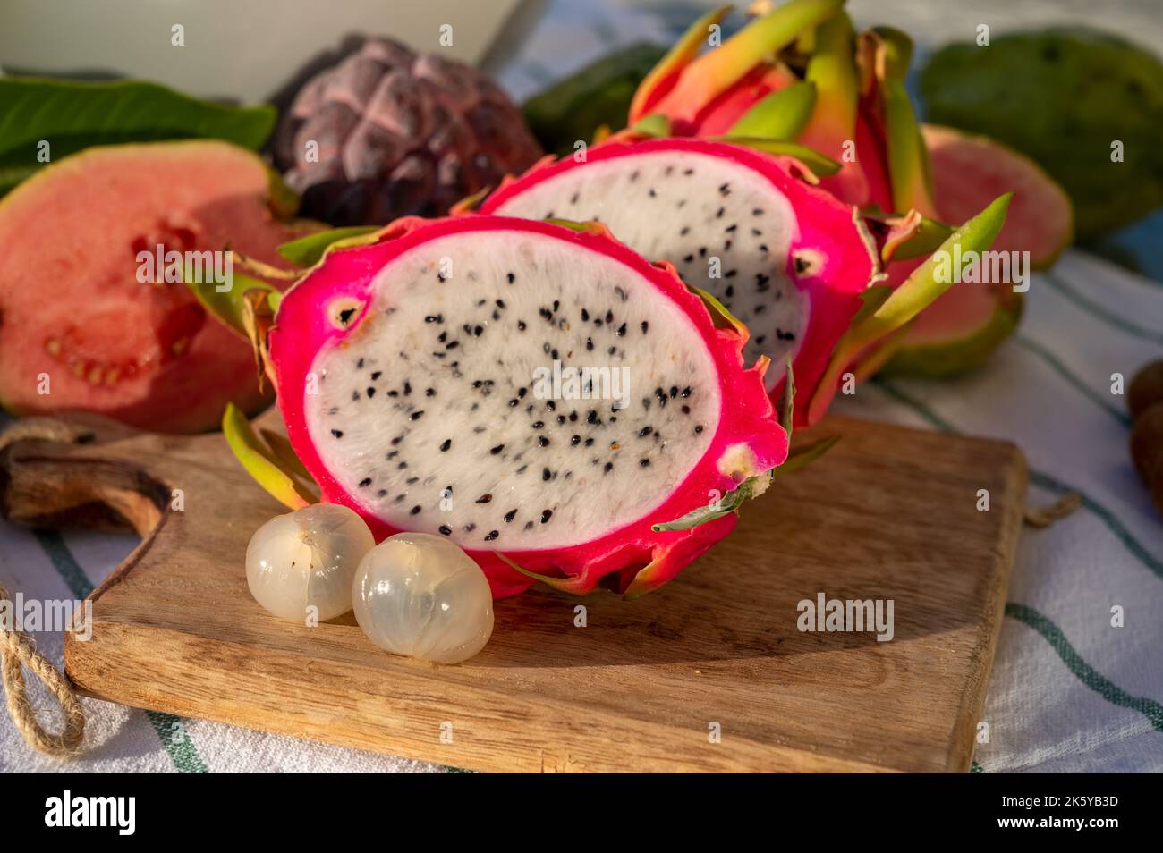 Colorful ripe dragon fruit and peeled lychees, tasty tropical exotic ...