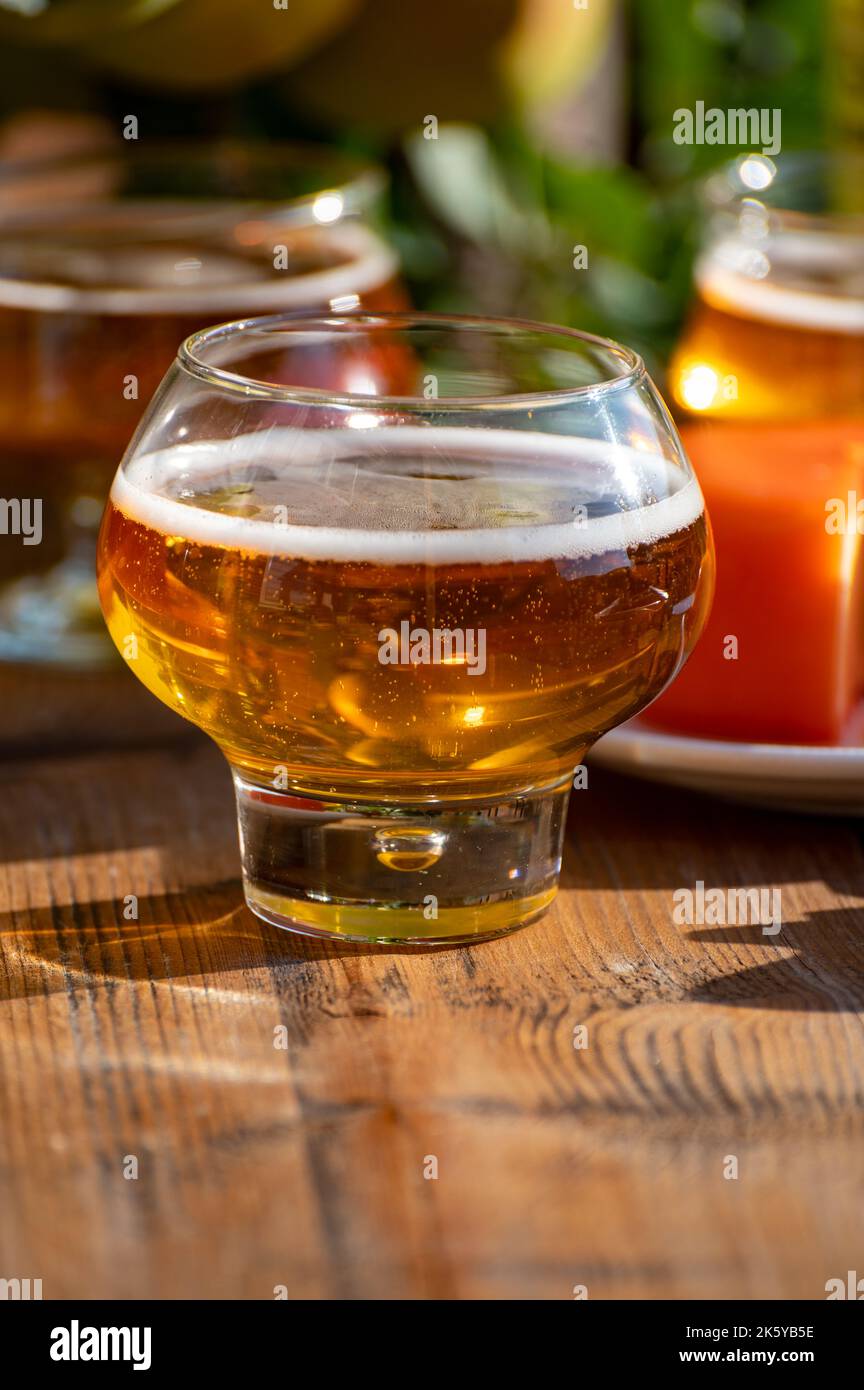 Food and drink pairing, apple cider in glasses produced on organic farm ...