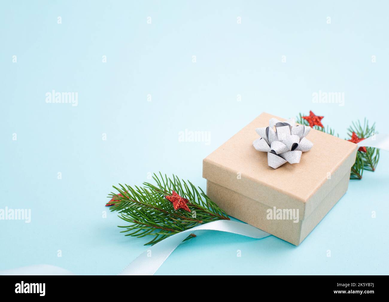 Christmas holiday greeting card with little gift boxes, stars and fir ...