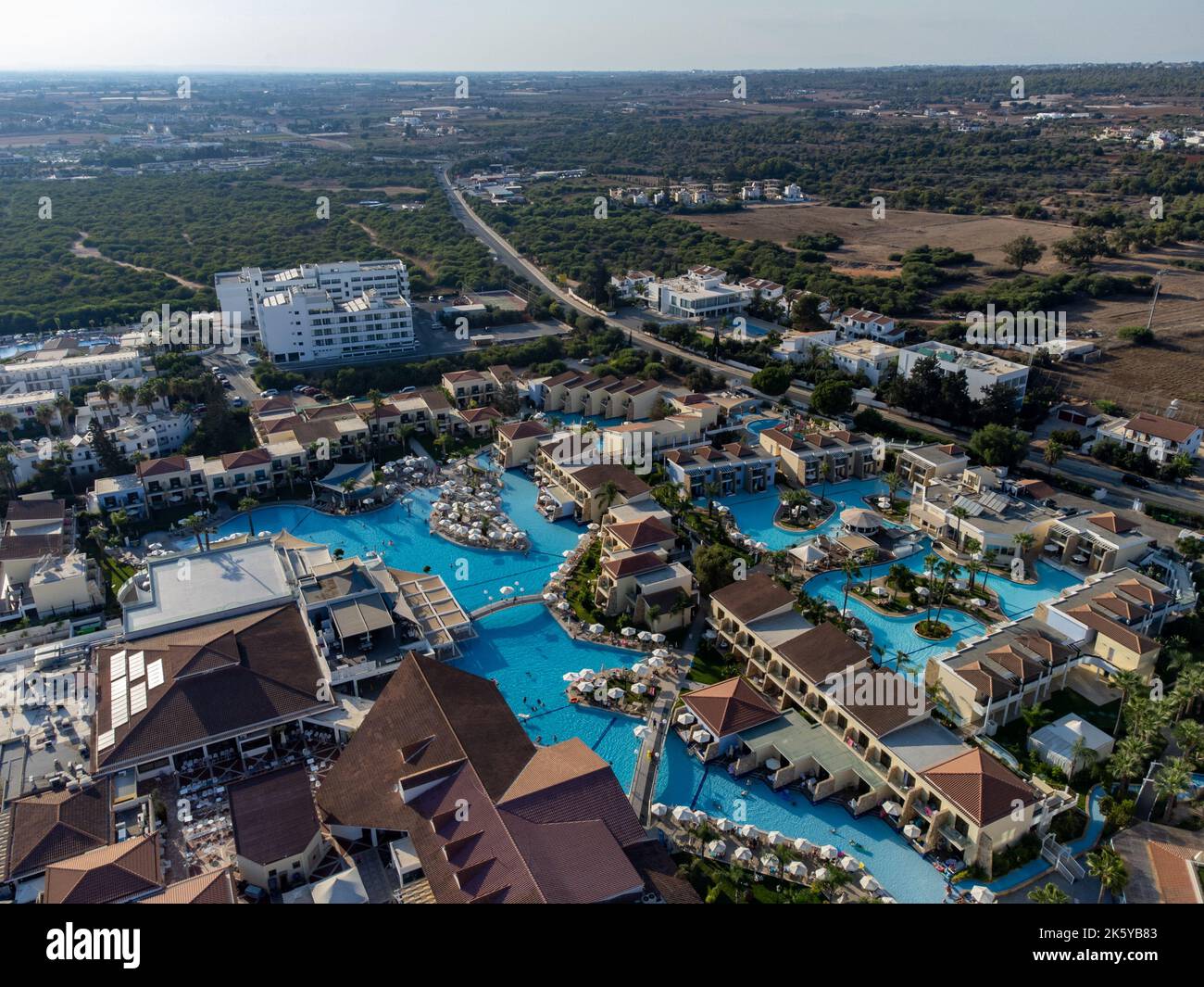 Aerial panoramic view on holidays villas and resorts and blue crystal ...