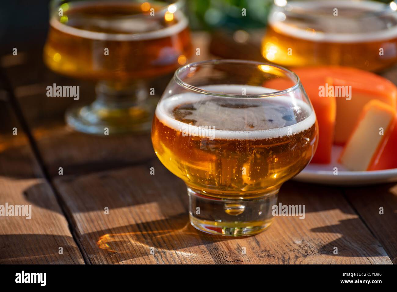 Food and drink pairing, apple cider in glasses produced on organic farm ...