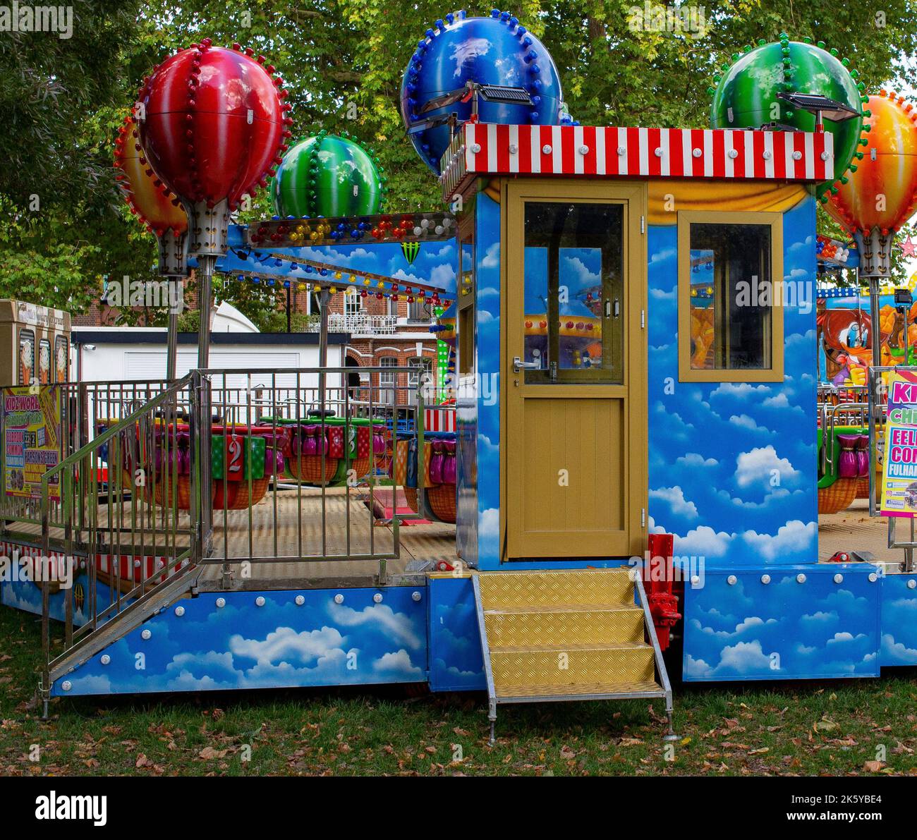 Fairground at Parsons Green, West London, UK; super-bright coloured ...