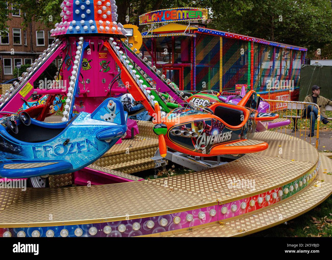 Fairground at Parsons Green, West London, UK; super-bright coloured ...
