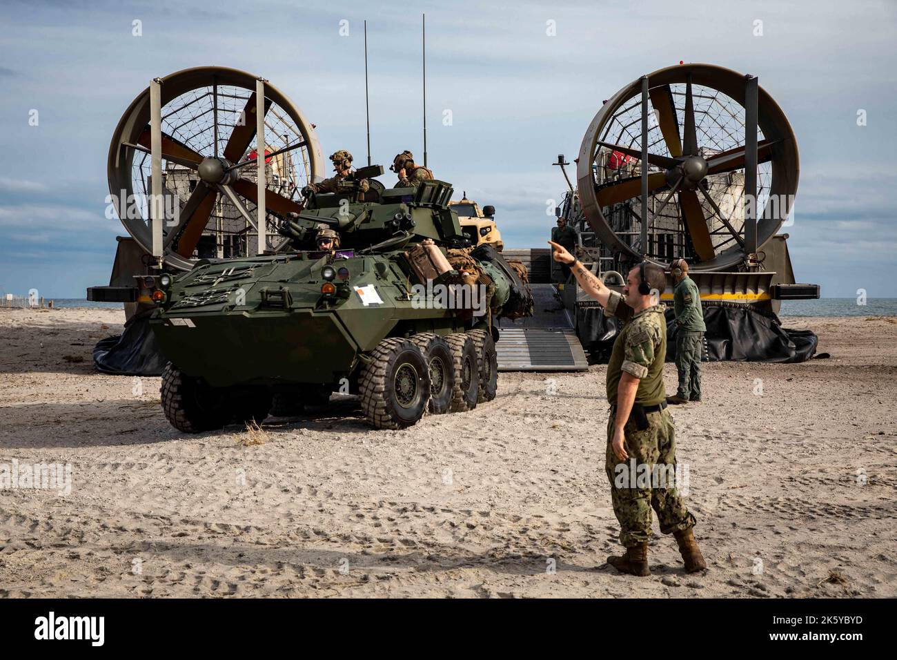 U.S. Navy Construction Mechanic 3rd Class Brandon Baker, assigned to ...