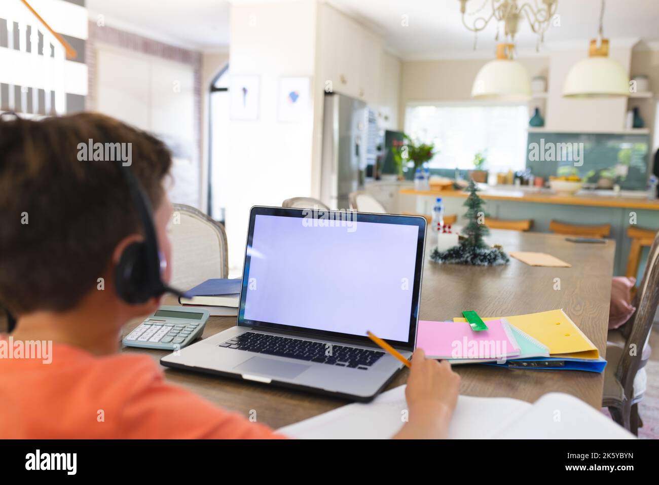 Boy using computer with headphones hi-res stock photography and images ...