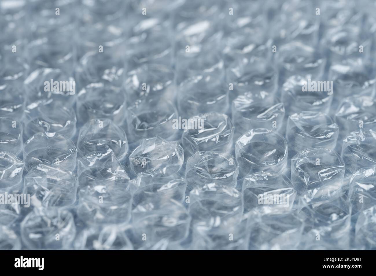 Packing air bubble background macro close up view Stock Photo - Alamy