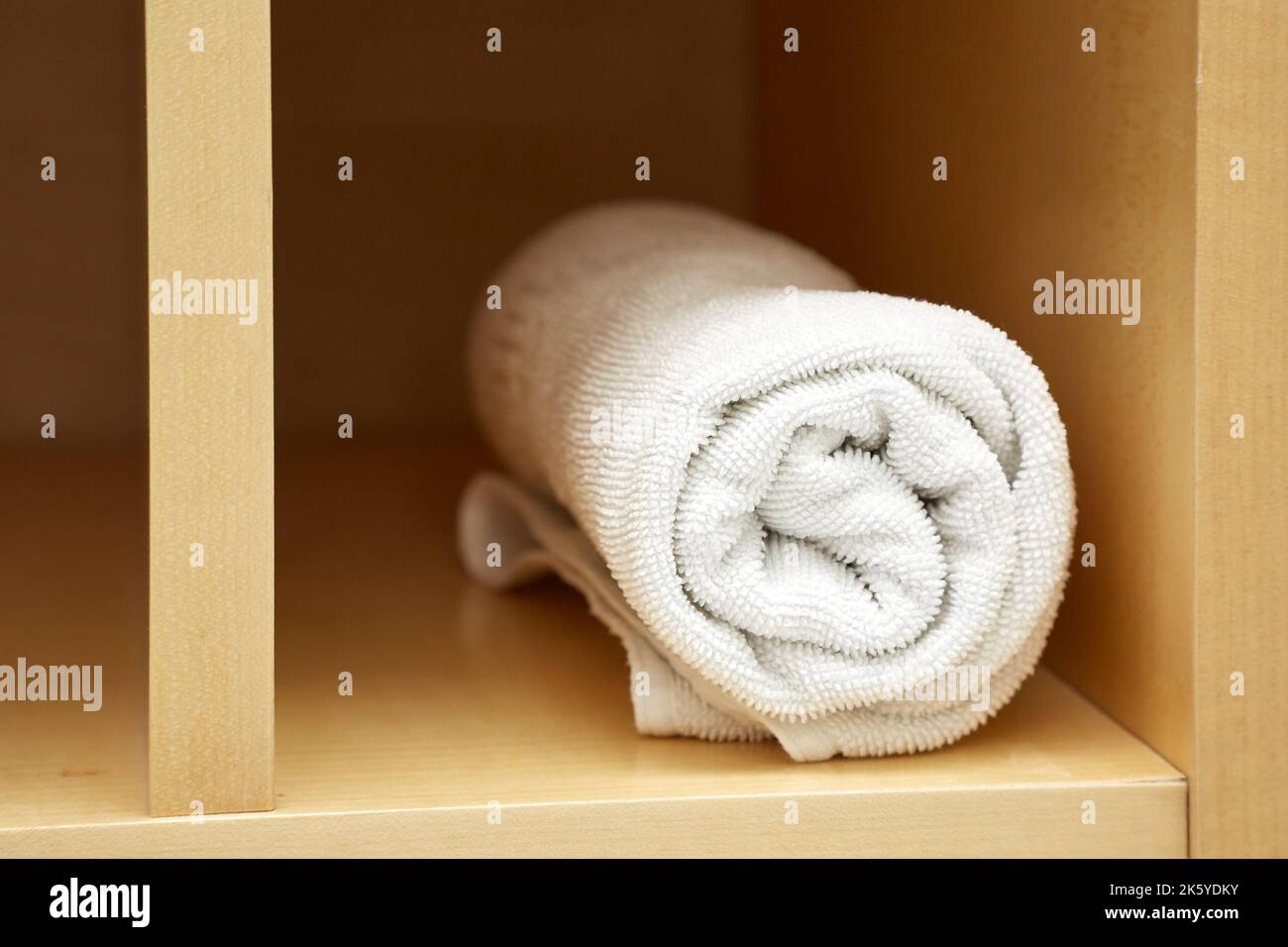 Clean towel in a cabinet Stock Photo - Alamy