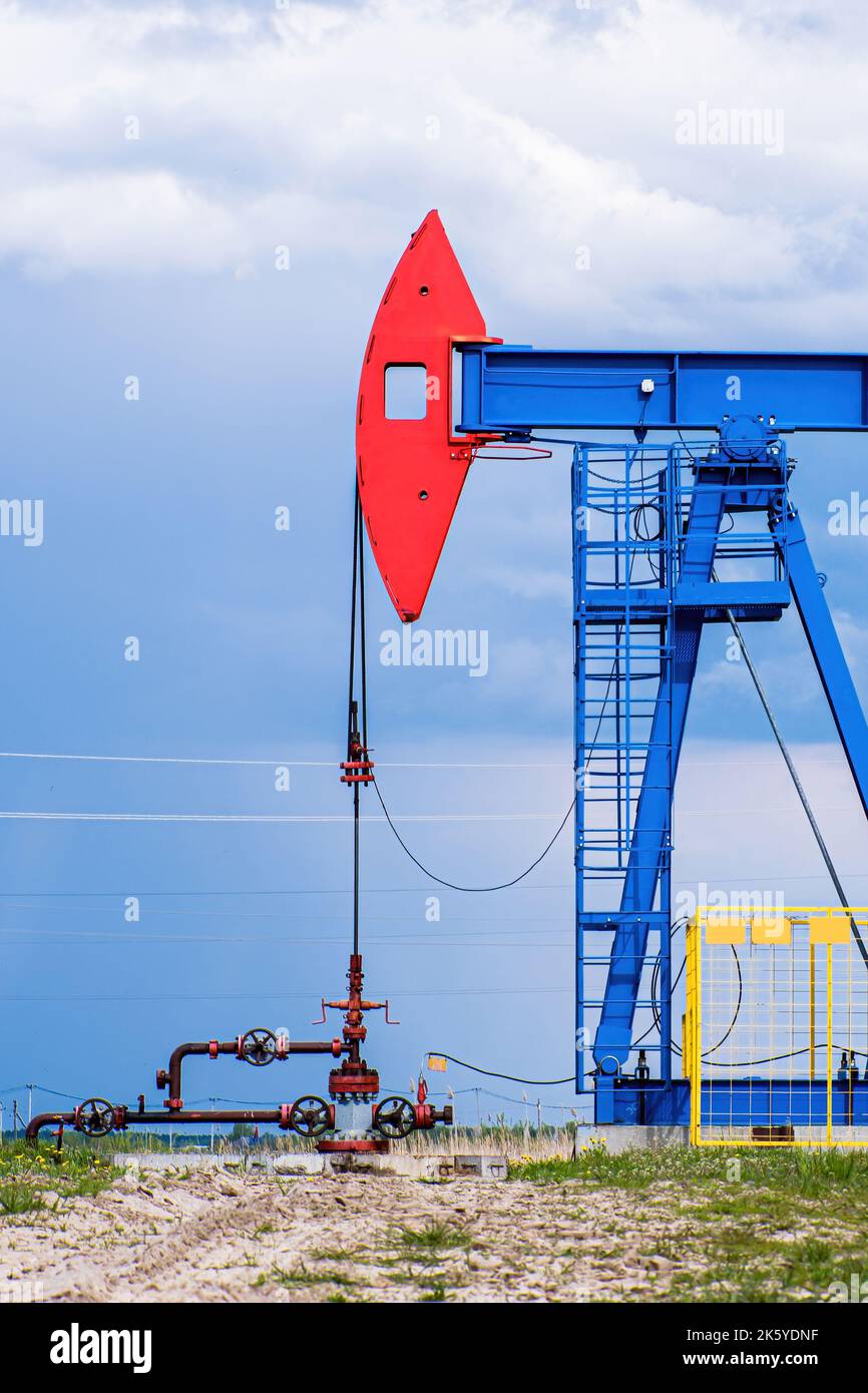 Extraction of crude oil in oilfield. Oil drilling rig pumps oil ...