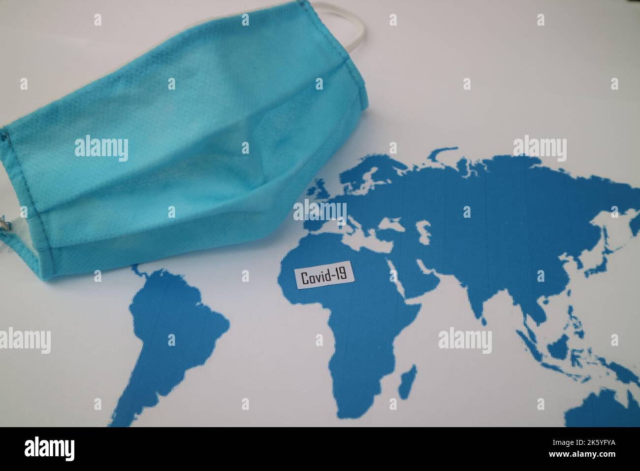 Face mask with world map. The Covid-19 outbreak around the world ...