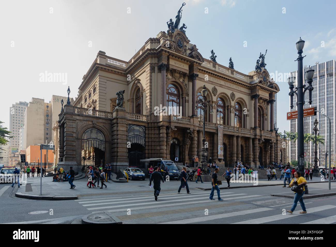 Sao Paulo, Brazil. 16 June, 2014. Passers-by walk past Theatro ...