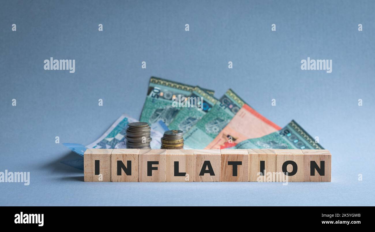 Letters of the alphabet Inflation on wood cubes with currency notes and ...