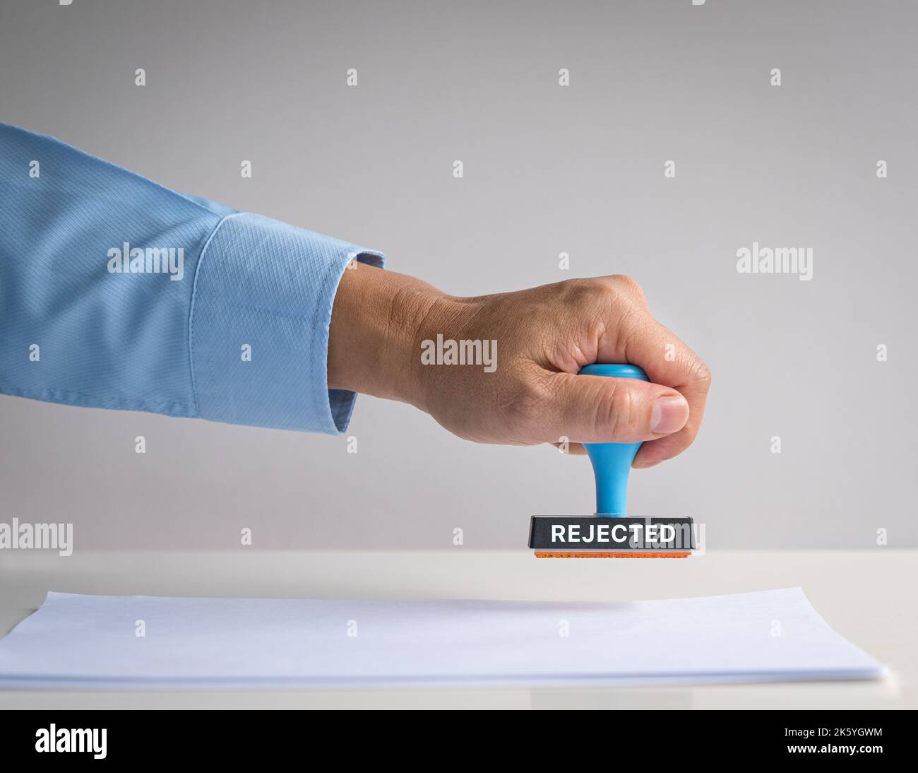 Rubber stamp, hand pressing on paper, with word Rejected Stock Photo ...