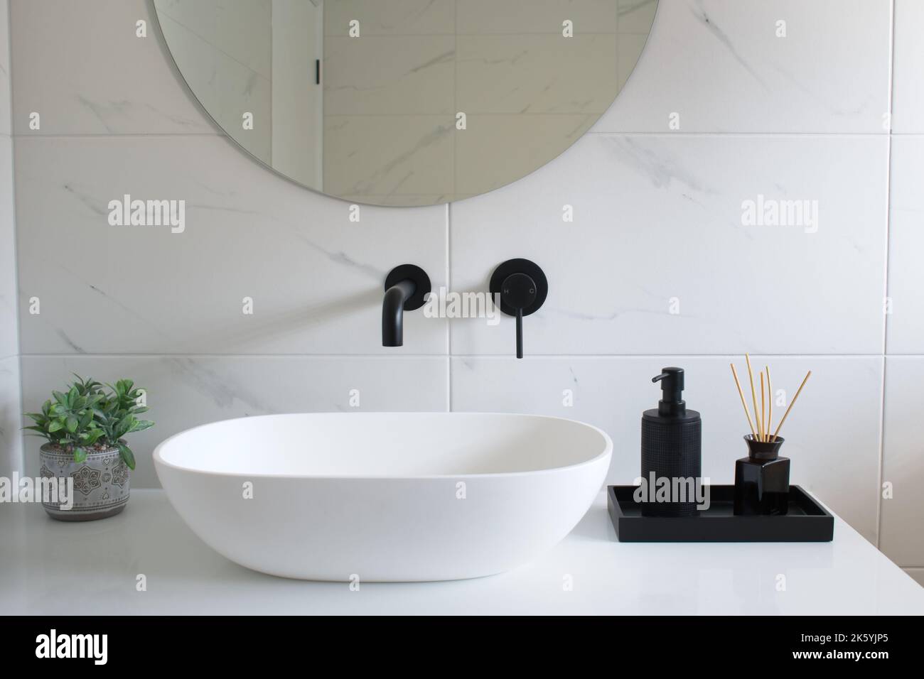 Modern white bathroom with black tap ware and accessories Stock Photo ...
