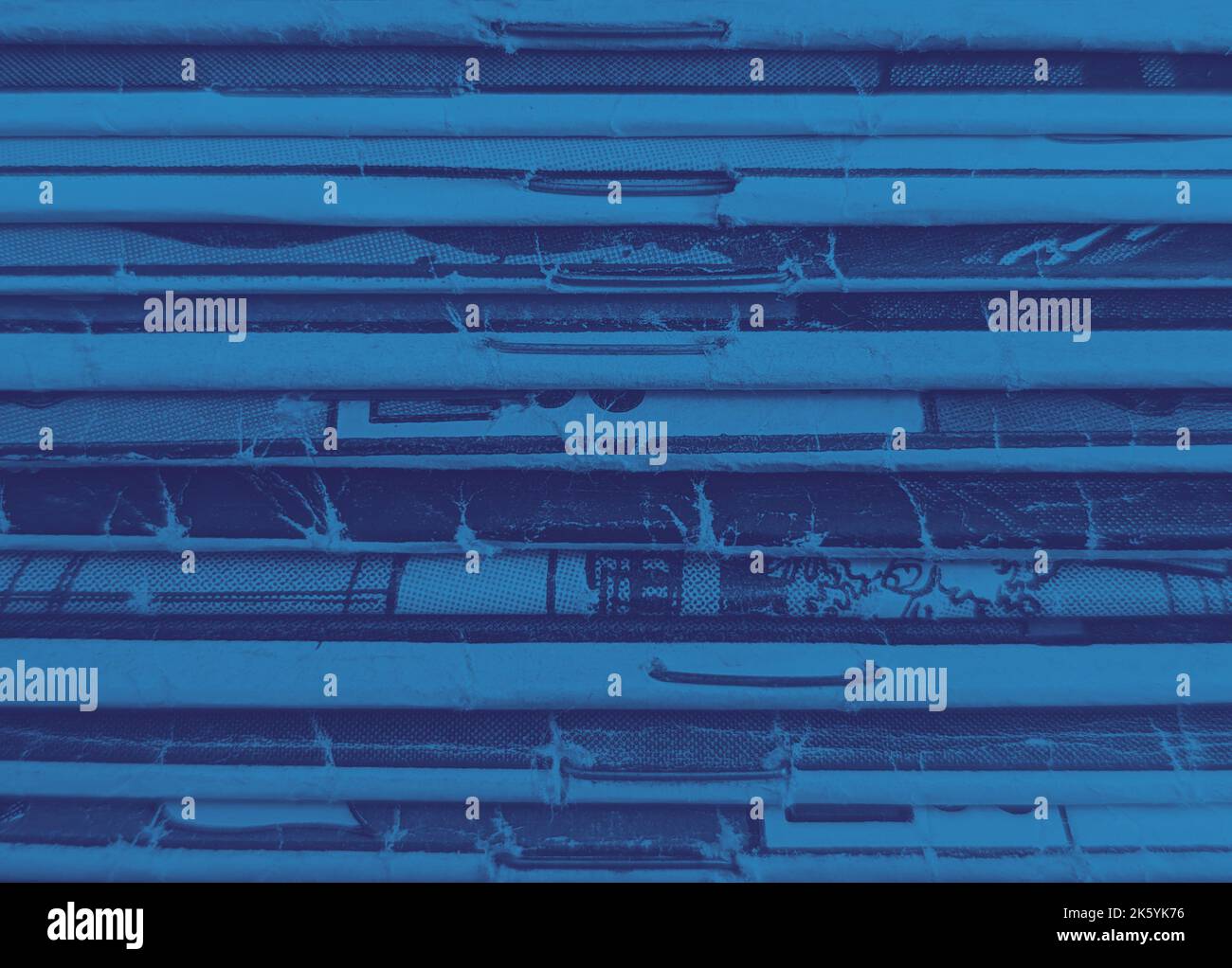 Stack of old vintage comic books creates a colorful background texture ...