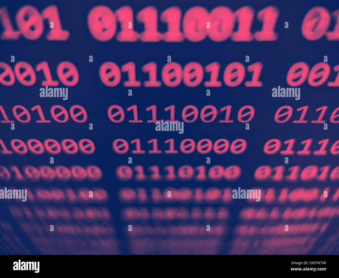 Closeup view of binary computer code with 1s and 0s displayed on a screen with a focus blur ...
