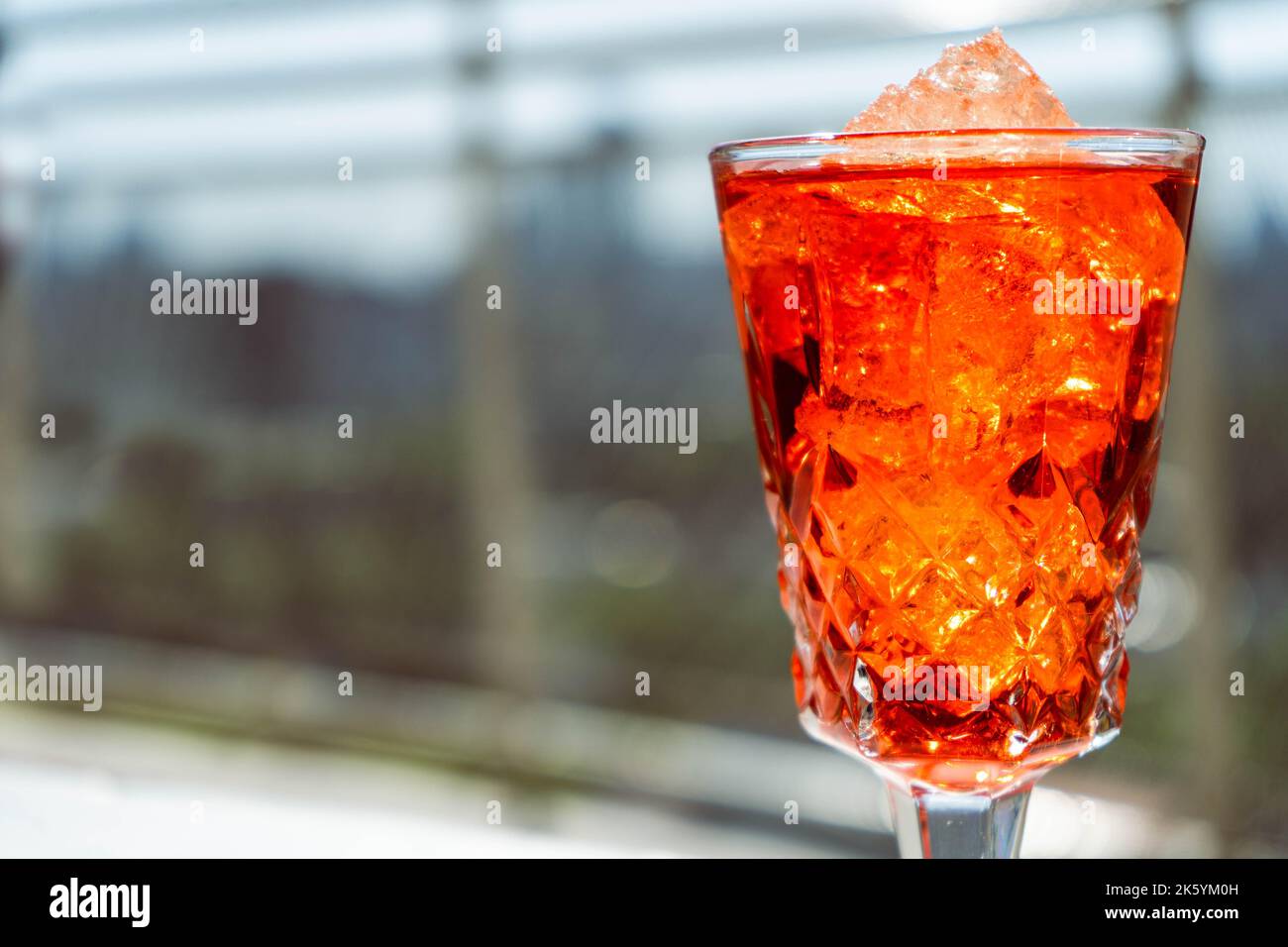 A Close-up of a glass of an exquisite red cocktail, Normal view ...