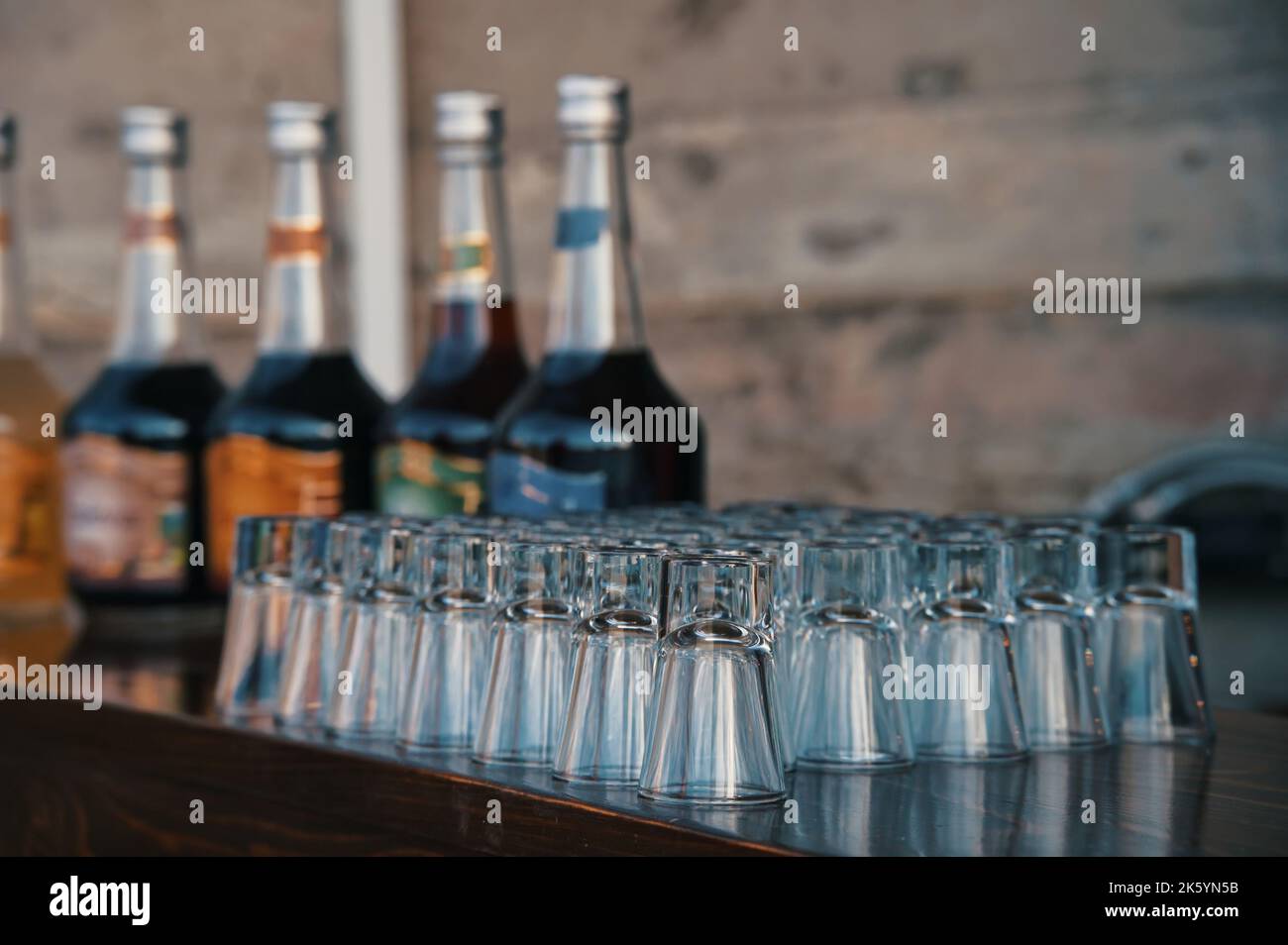 Empty alcohol bottles table hi-res stock photography and images - Alamy