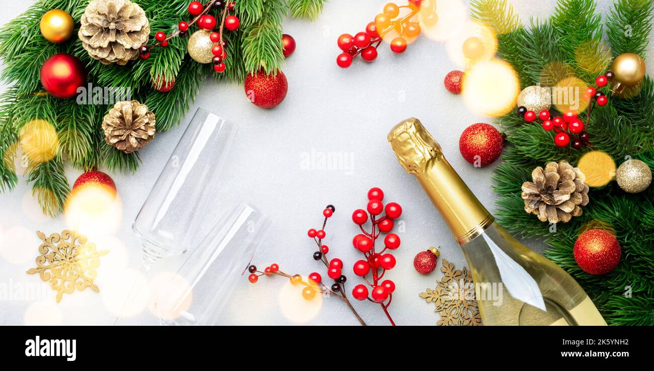 Christmas festive background with champagne bottle and wine glasses ...