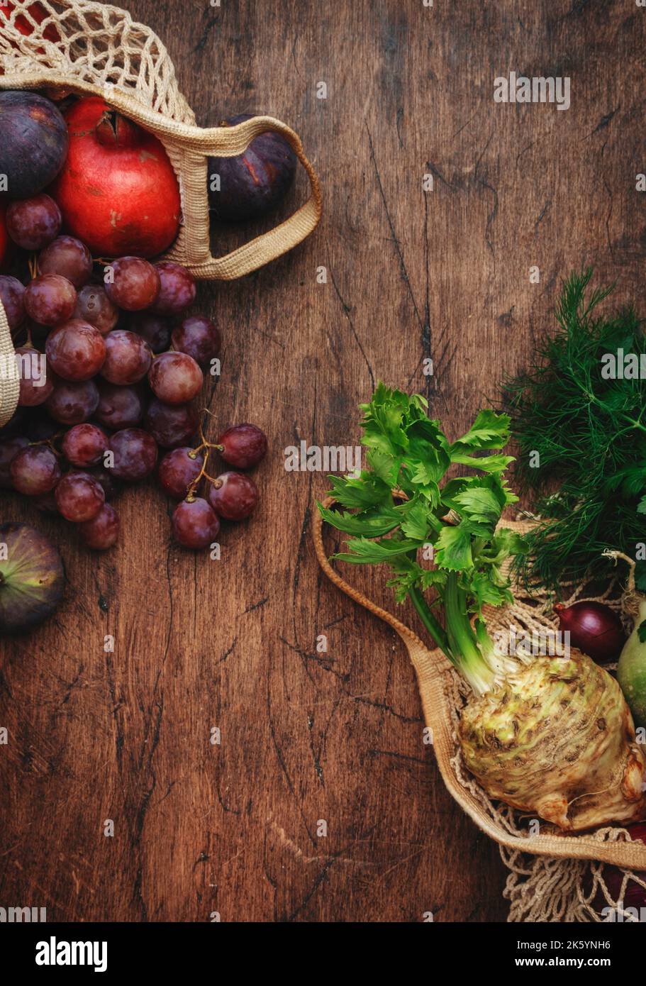 Autumn food background with vegetables, root crops and fruits in string ...