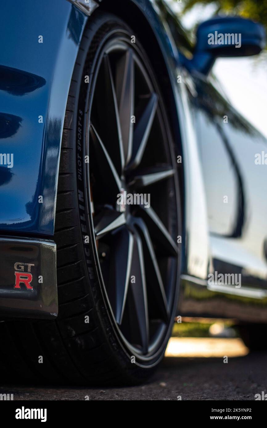 A vertical shot of a blue Hyundai Genesis Coupe luxurious car wheel ...