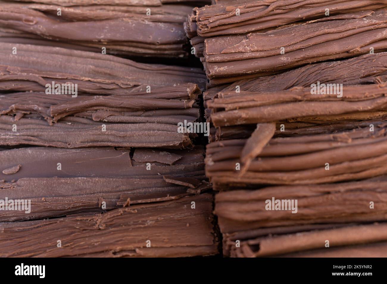 Delicious dark chocolate in branch. Cocoa with sugar in thin layers ...