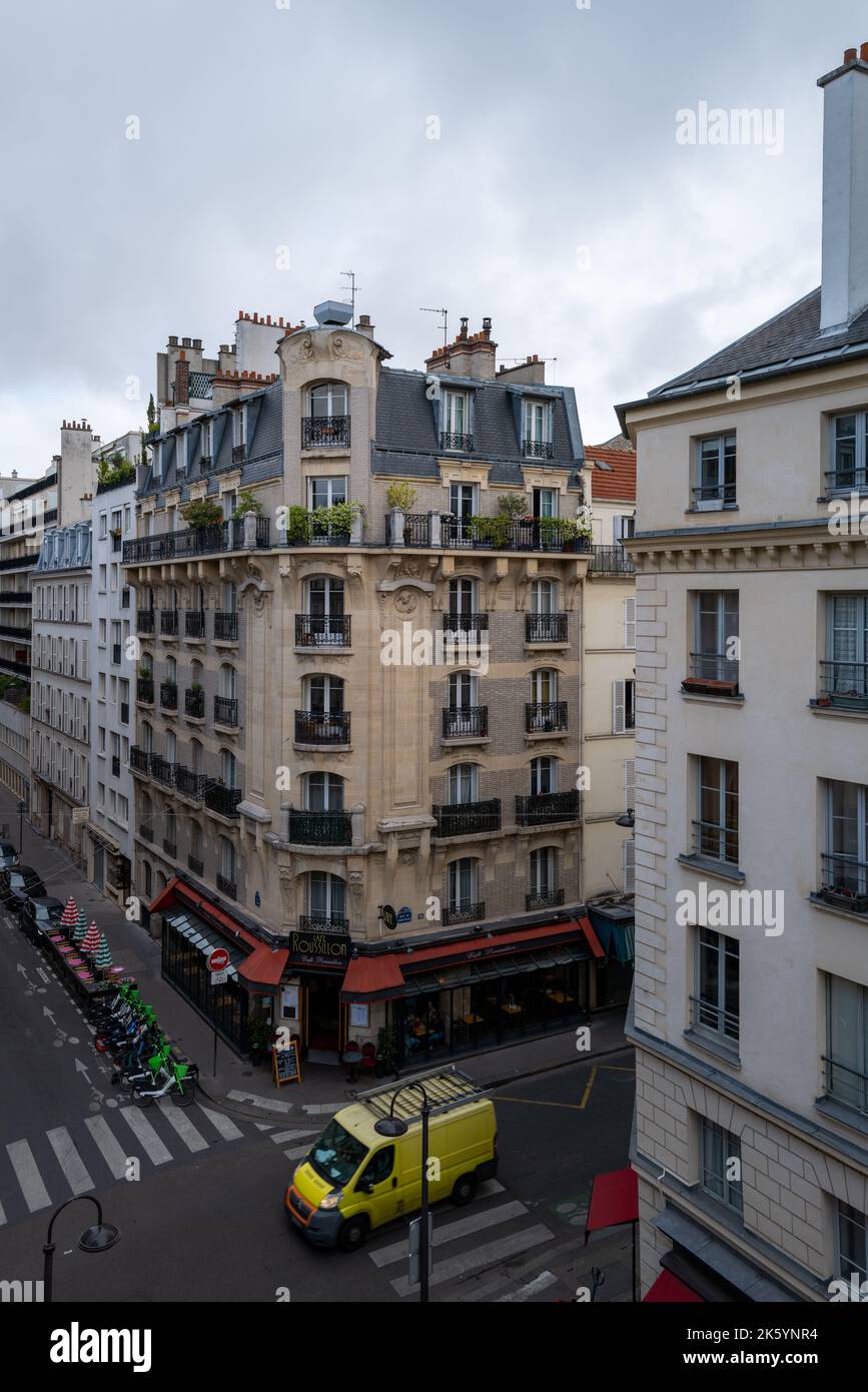 A vertical shot of a street with old buildings in Paris, France in ...