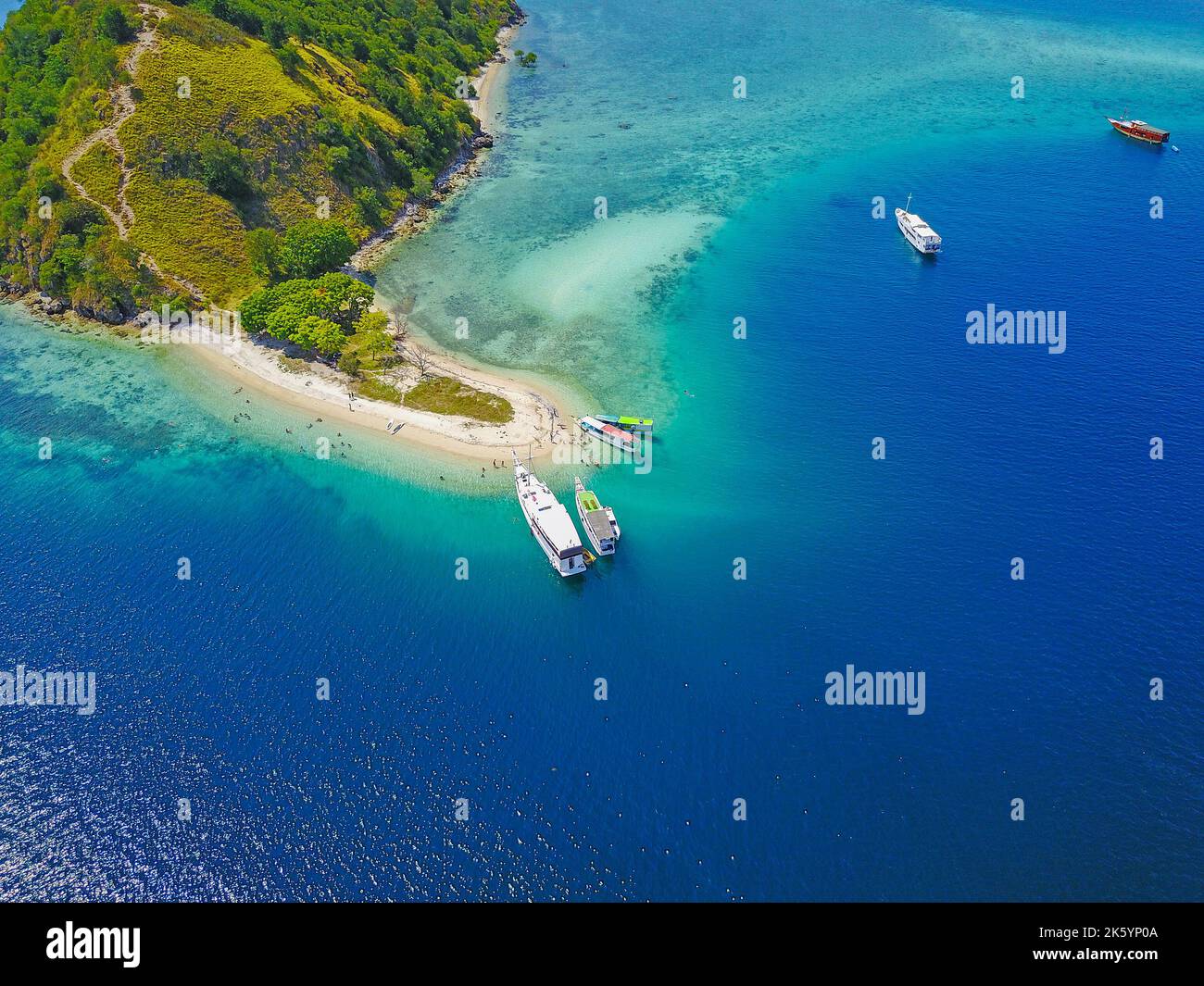 Beautiful aerial view of beaches and tourist boat sailing in Flores ...
