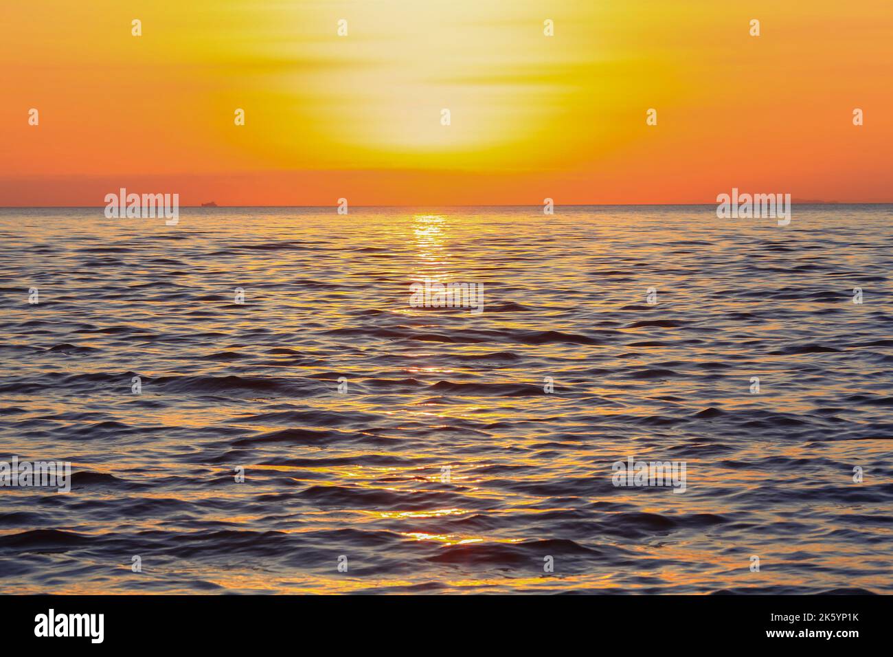 An image of a nice red sunset with a big yellow sun Stock Photo - Alamy