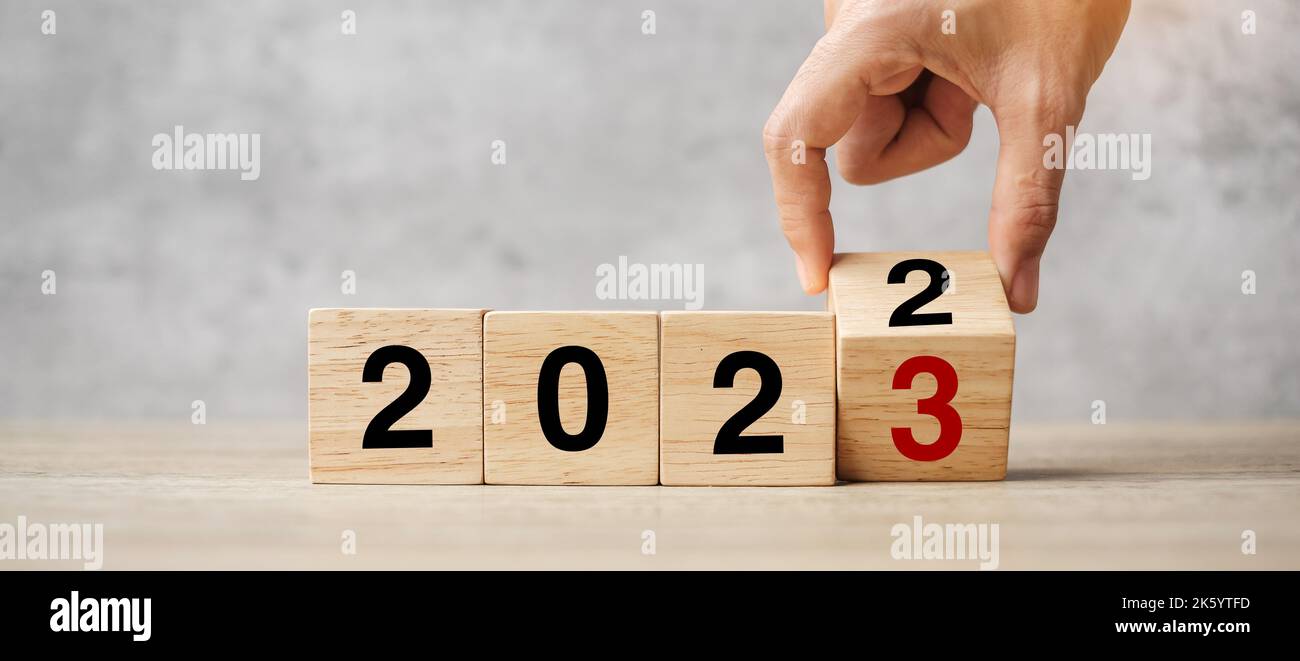 hand flipping block 2022 to 2023 text on table. Resolution, strategy ...