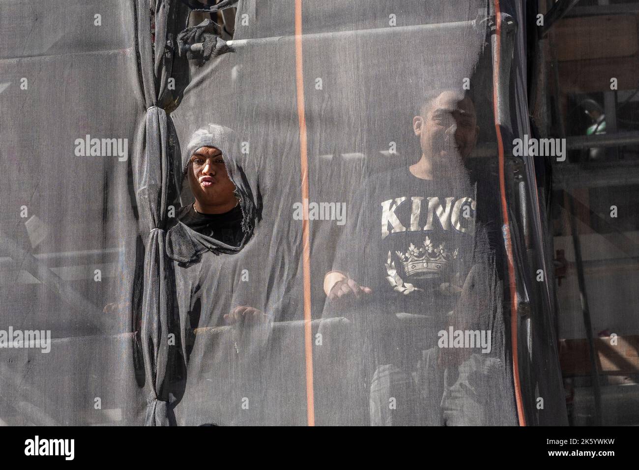 Construction workers watching from scaffoldings annual Columbus Day ...