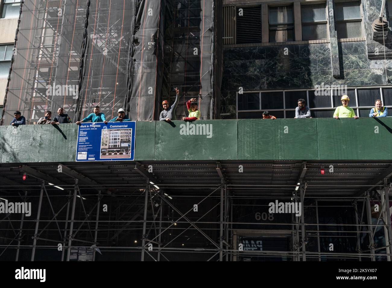 Construction workers watching from scaffoldings annual Columbus Day ...