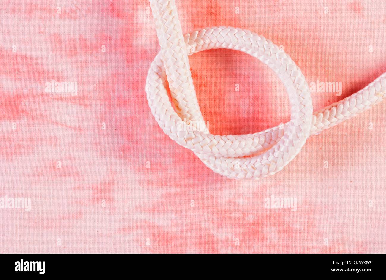 Tied white rope , against red background , nautical rope Stock Photo ...