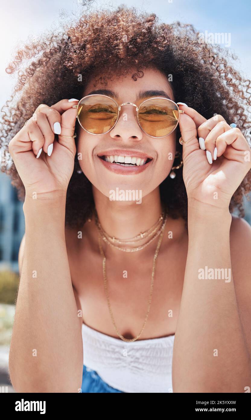 Portrait of young trendy beautiful mixed race woman with an afro ...