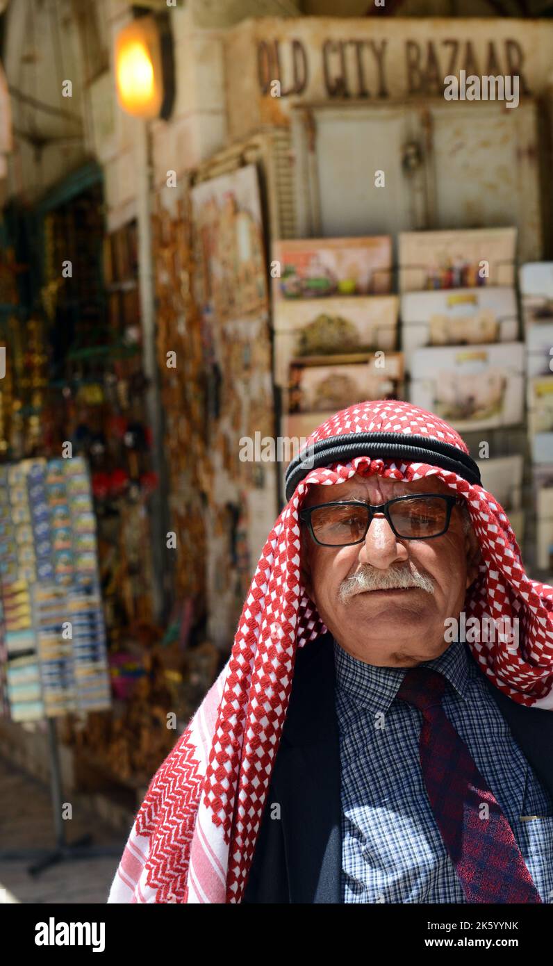 Portrait of a Palestinian man wearing a traditional Kuffiya on his head ...