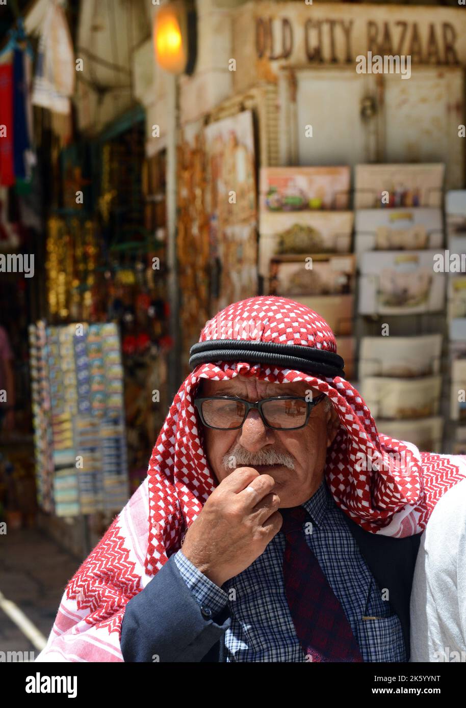 Portrait of a Palestinian man wearing a traditional Kuffiya on his head ...