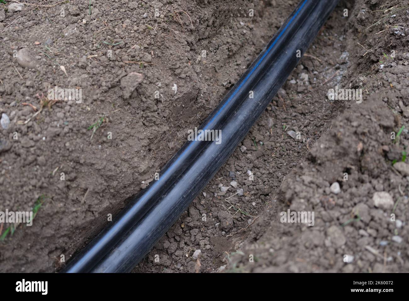 Frame for connecting pipes in trench of ground Stock Photo - Alamy
