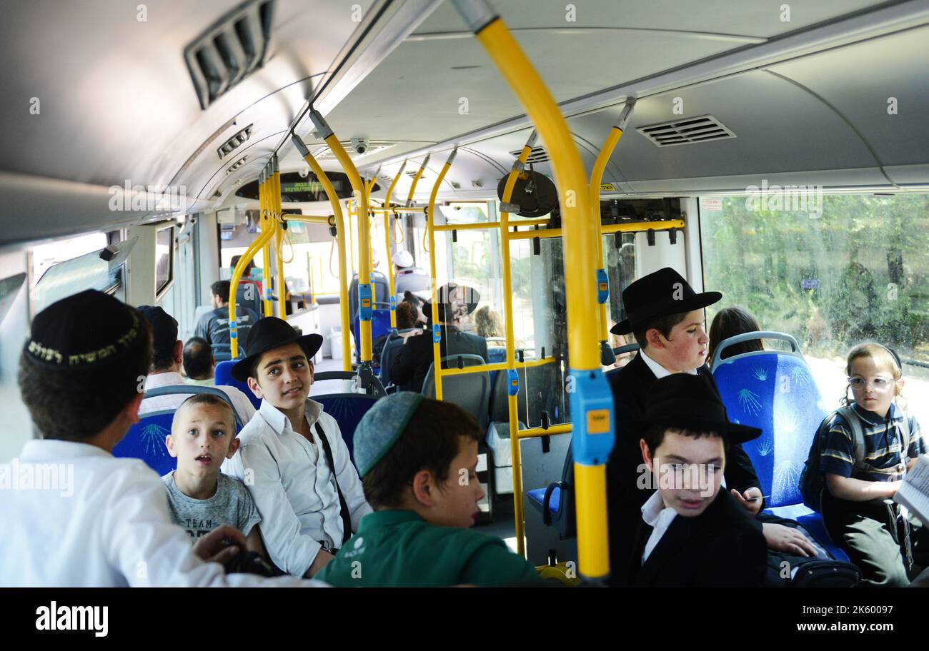 Jewish religious boys on a public bus in Jerusalem, Israel Stock Photo ...