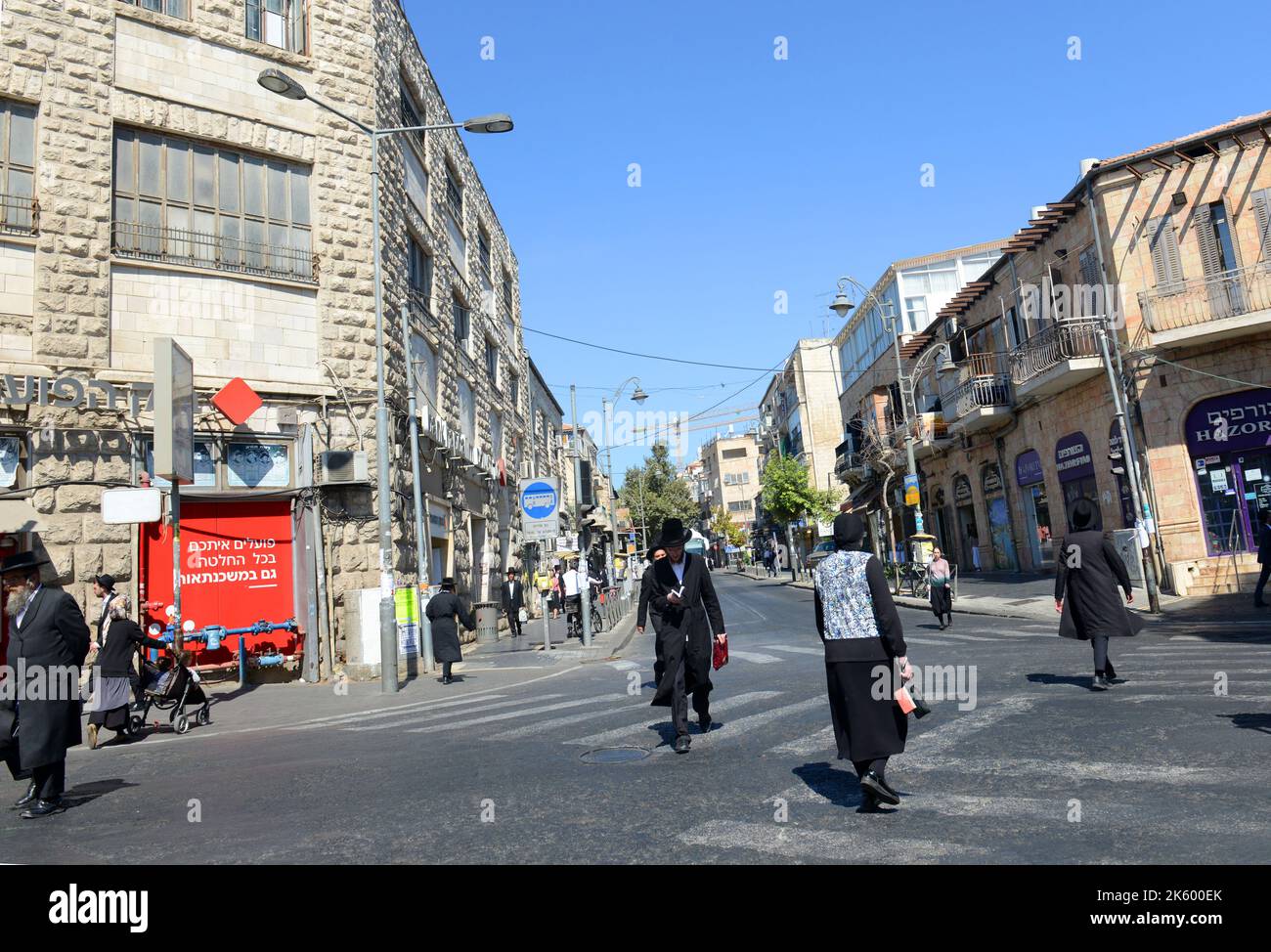 Pedestrians crossing the road at the ultra-Orthodox neighborhood of ...