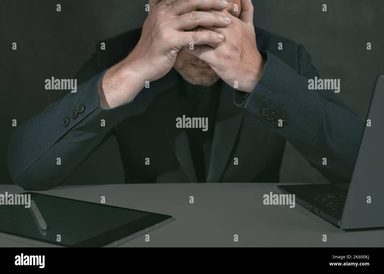 Tired businessman, frustrated with business failures and under stress ...