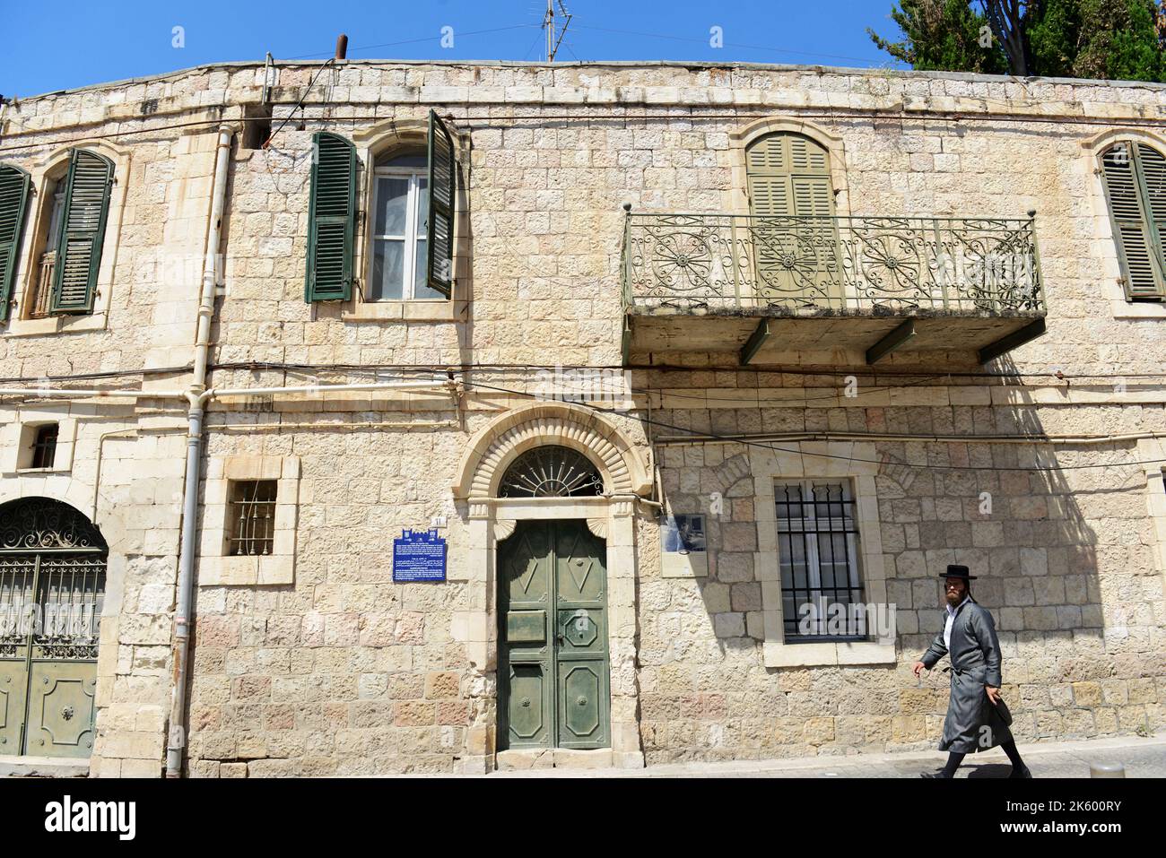 A Hassidic Jewish man walking by the historical Eliezer Ben-Yehuda's ...